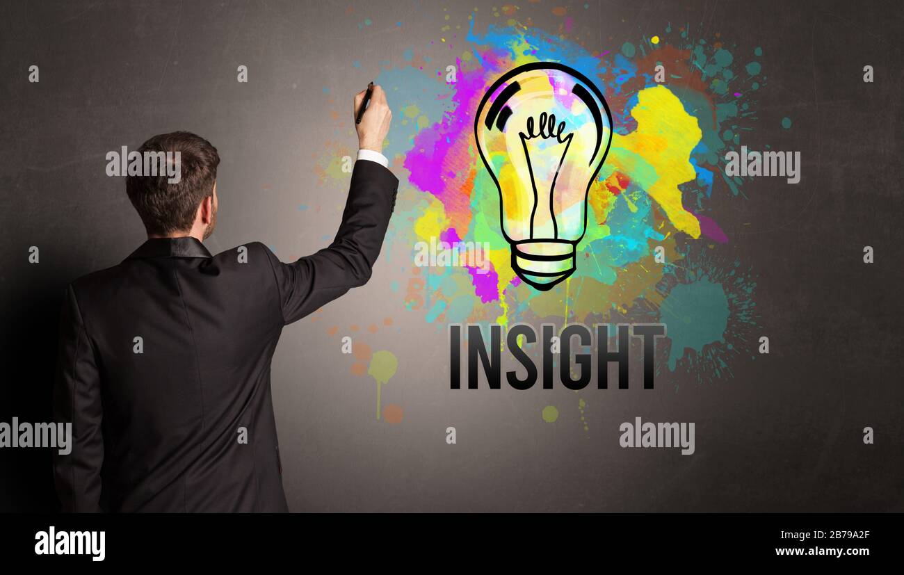 businessman drawing colorful light bulb with INSIGHT inscription on ...