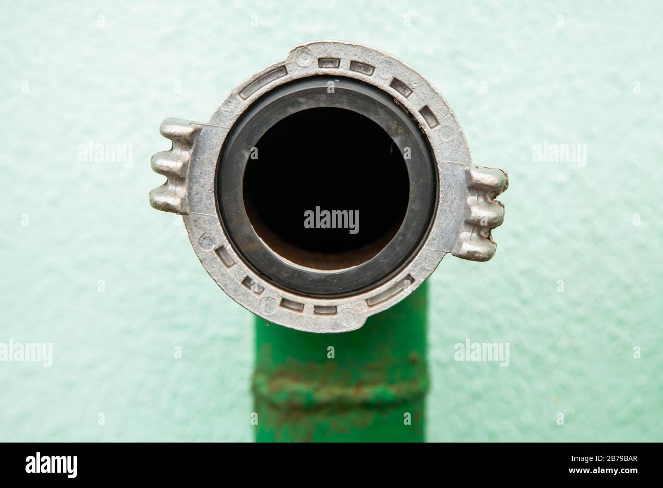 Fire hydrant nozzle green, close-up hose connection Stock Photo - Alamy