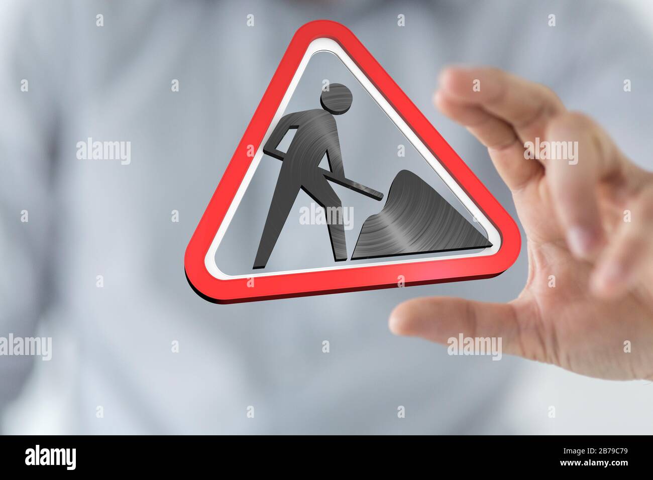 A under process sign in hand Stock Photo - Alamy