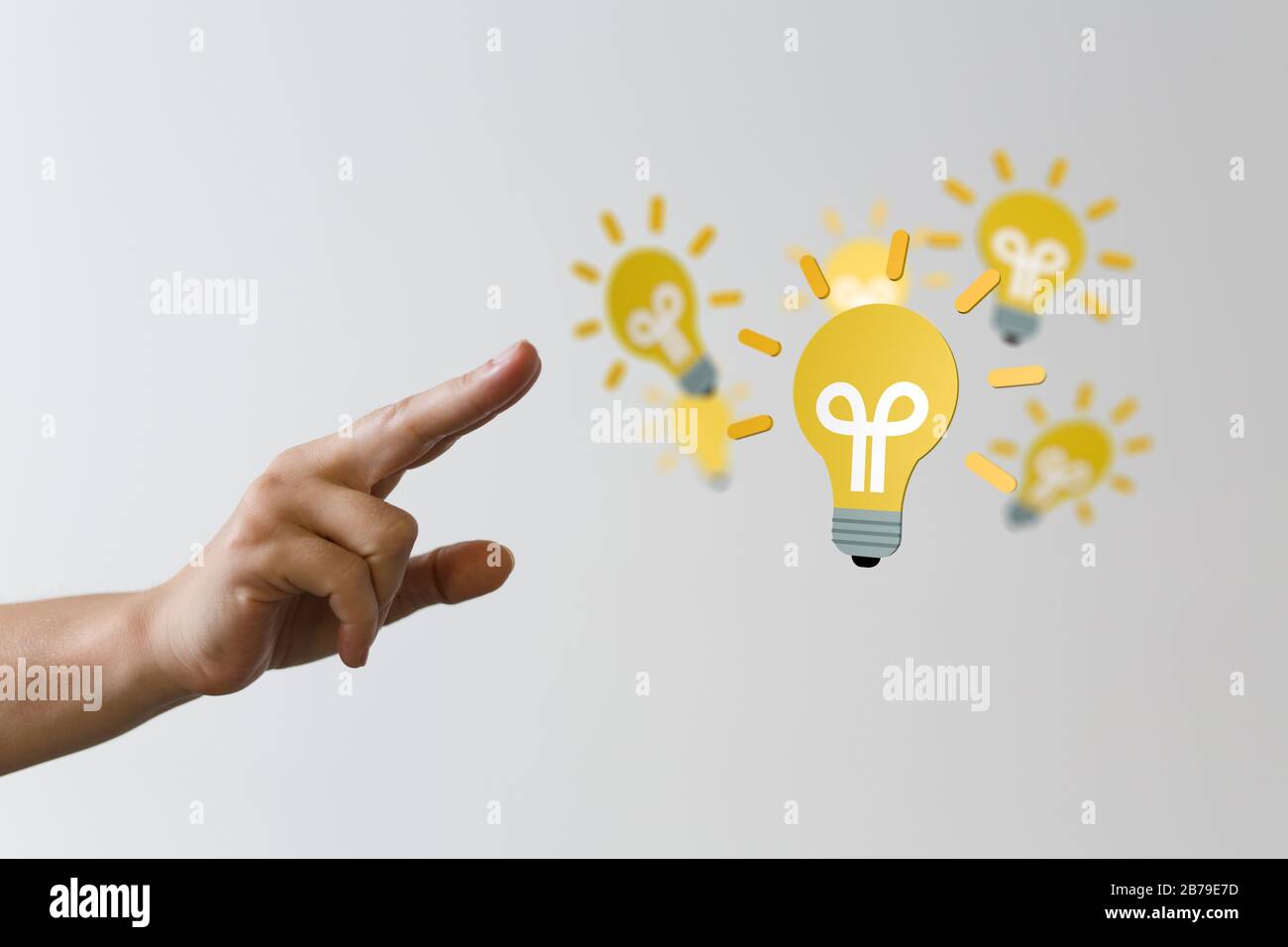 Hand and some light bulbs depicting innovative ideas and creative ...