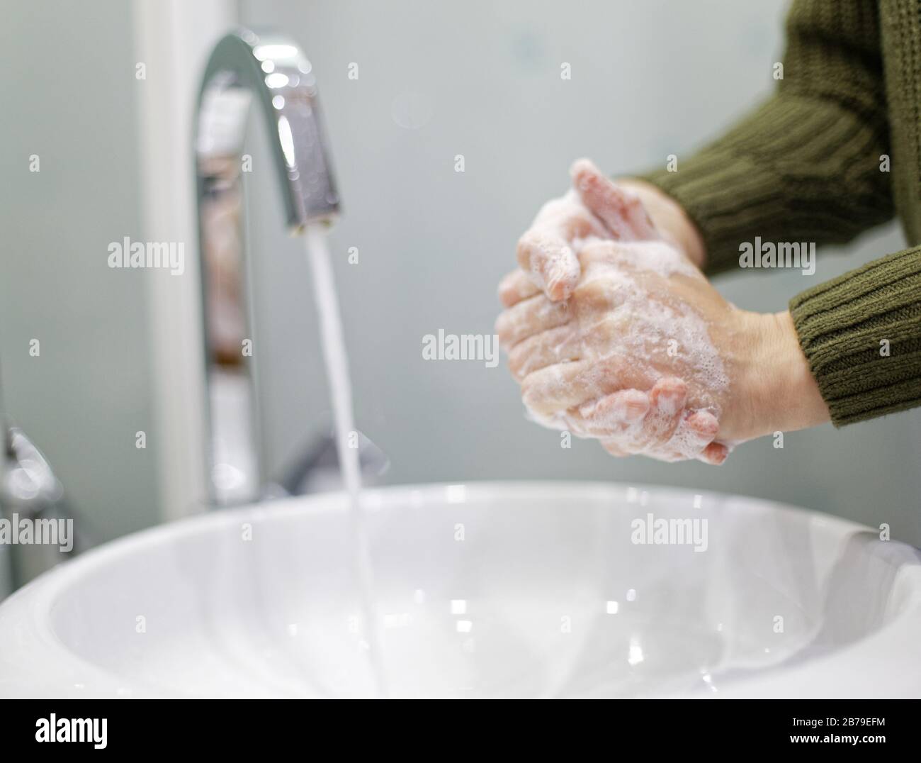 Woman washing hands water soap hi-res stock photography and images - Alamy