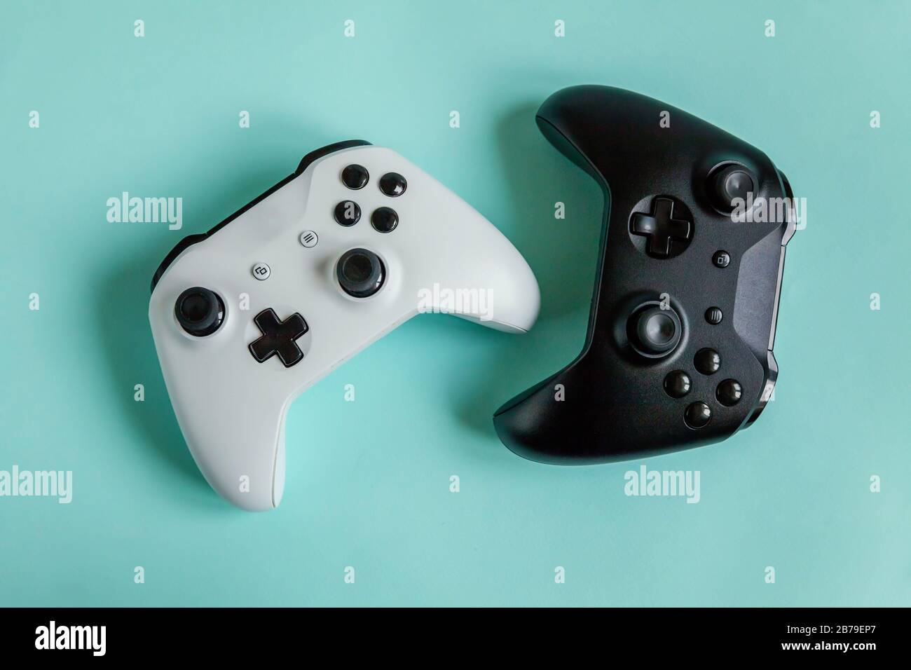White and black two joystick gamepad, game console isolated on pastel ...