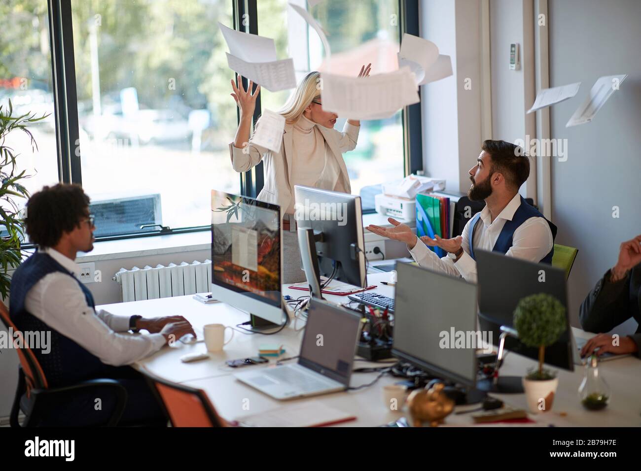 young angry leader woman yelling on young employees Stock Photo - Alamy