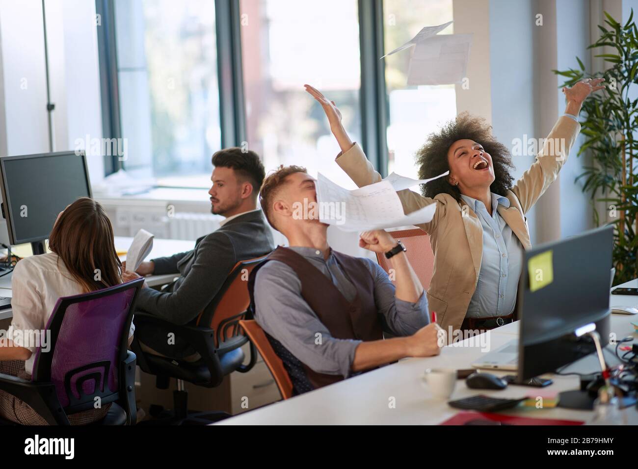 Teamwork concept.Happy employees celebrating successful project finish ...