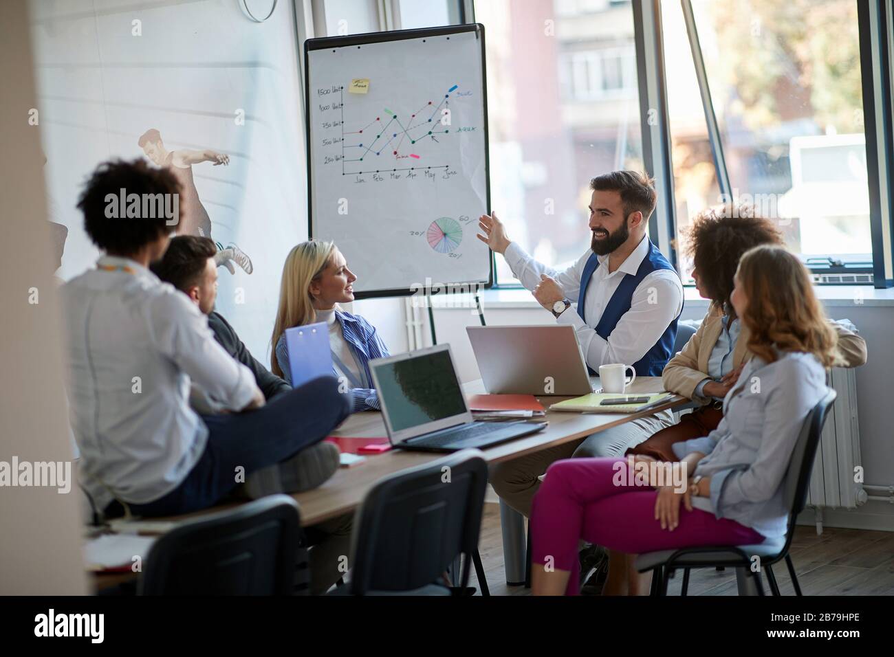 Leader briefing business people.Group of employees discussing ideas ...