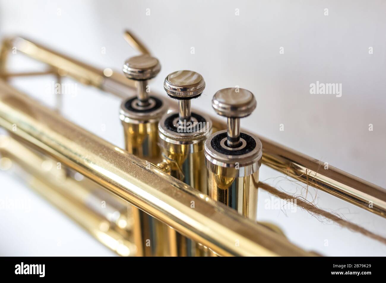 Wind musical instrument brass trumpet with pump screws Stock Photo - Alamy