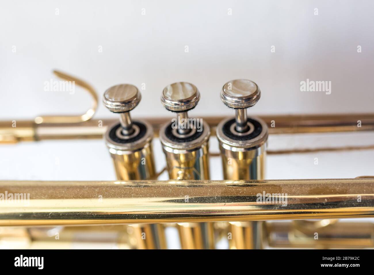 Wind musical instrument brass trumpet with pump screws Stock Photo - Alamy