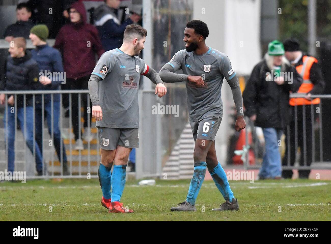 Curzon Ashton's Robert Evans (left) bumps elbows with Mohamud Ali after ...
