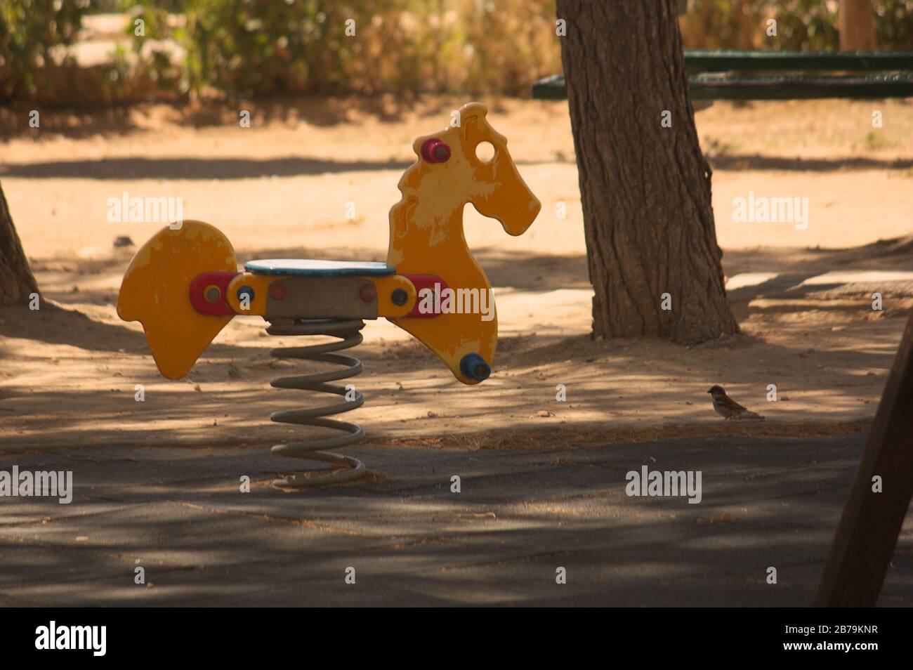 Closeup of a rocking chair in the shape of a horse in a public ...