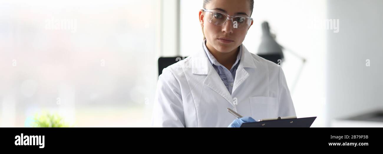 Serious woman working in light hi-res stock photography and images - Alamy