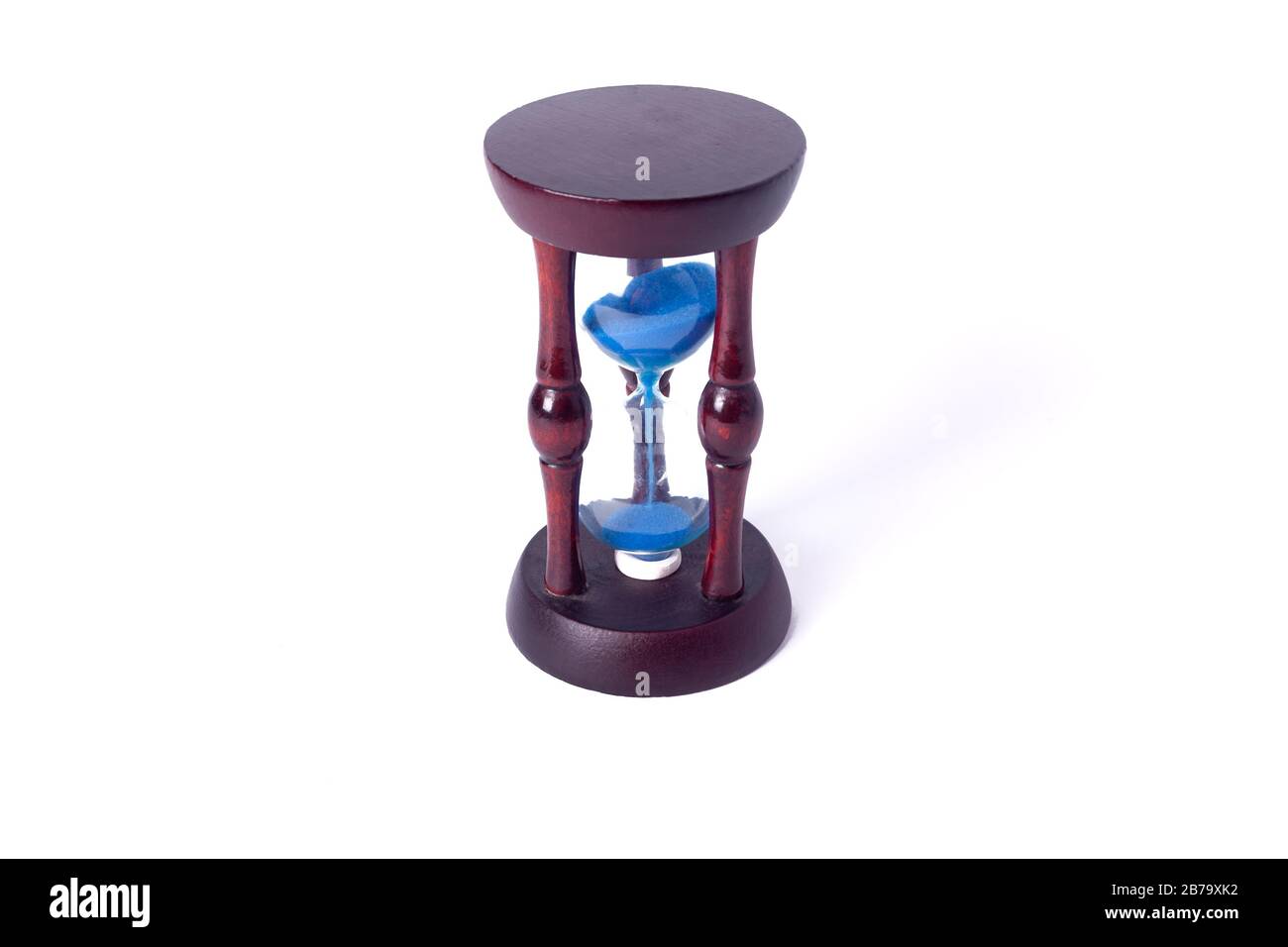 hourglass closeup on an isolated white background Stock Photo - Alamy