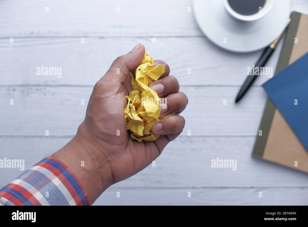 Crumpled paper ball in hand hi-res stock photography and images - Alamy