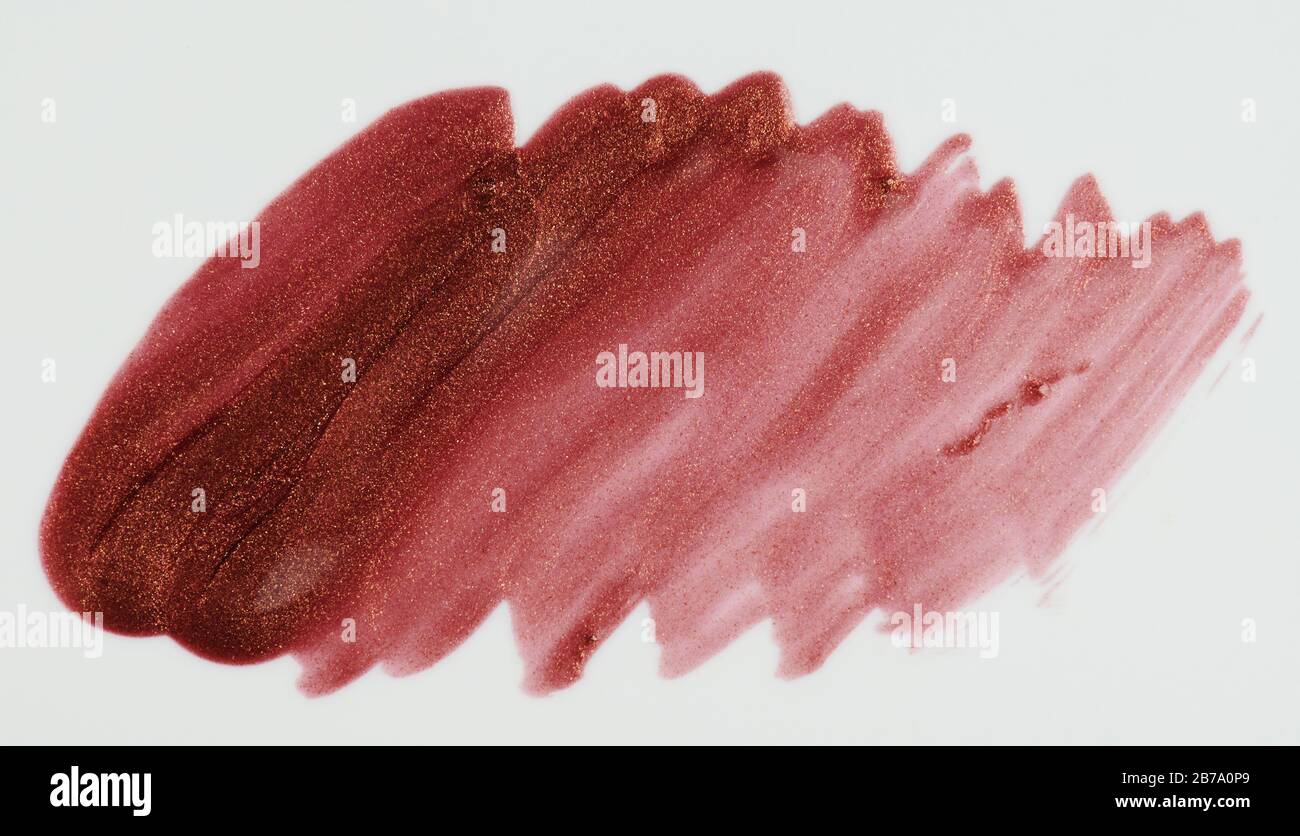 Sparkle red paint stain isolated on white background close up view ...