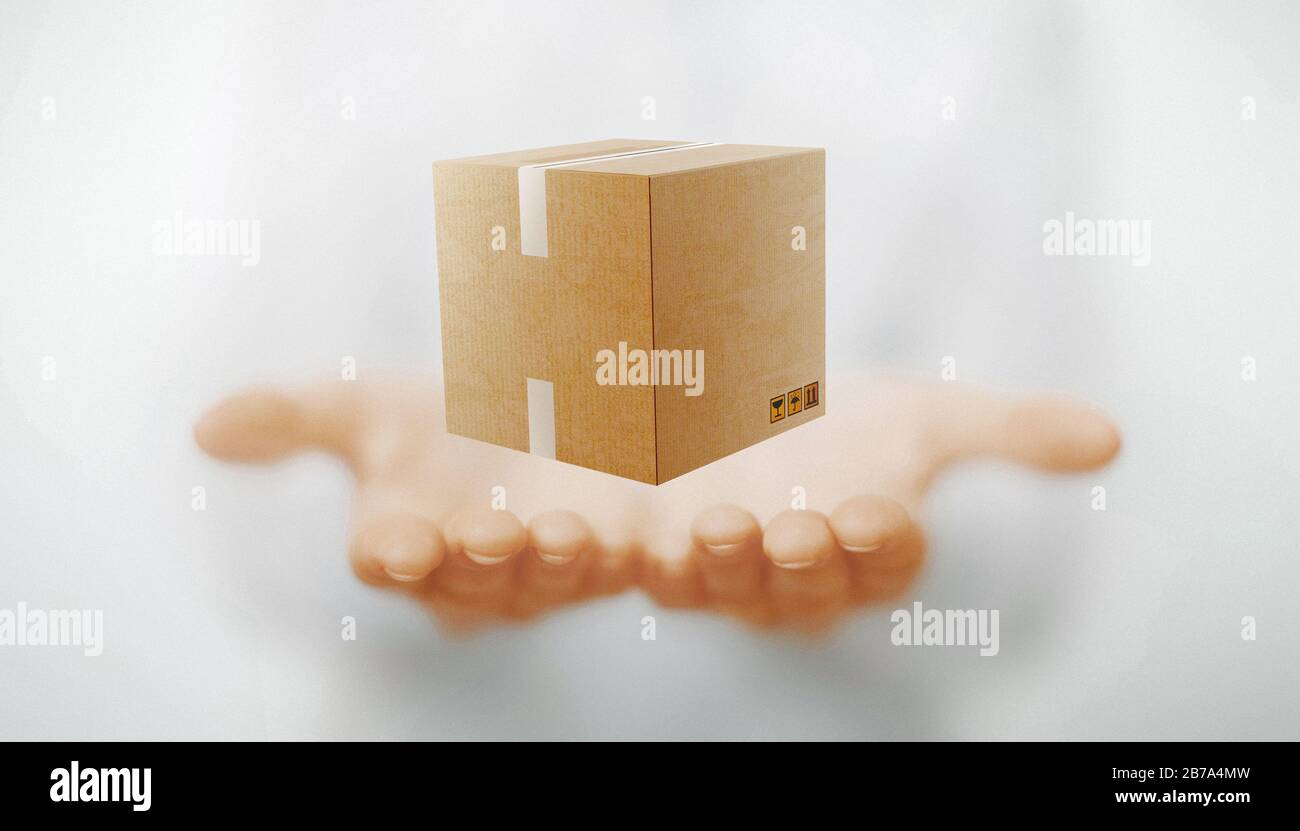 Hand with cartboard box, shipping or mail Stock Photo - Alamy