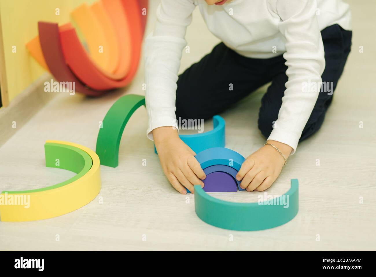 Boys play in different intelectual games in preschool classroom Stock ...