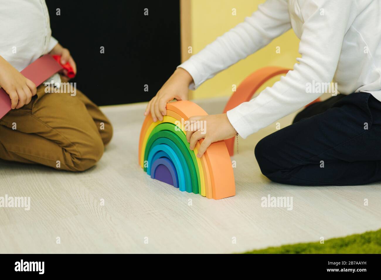 Boys play in different intelectual games in preschool classroom Stock ...