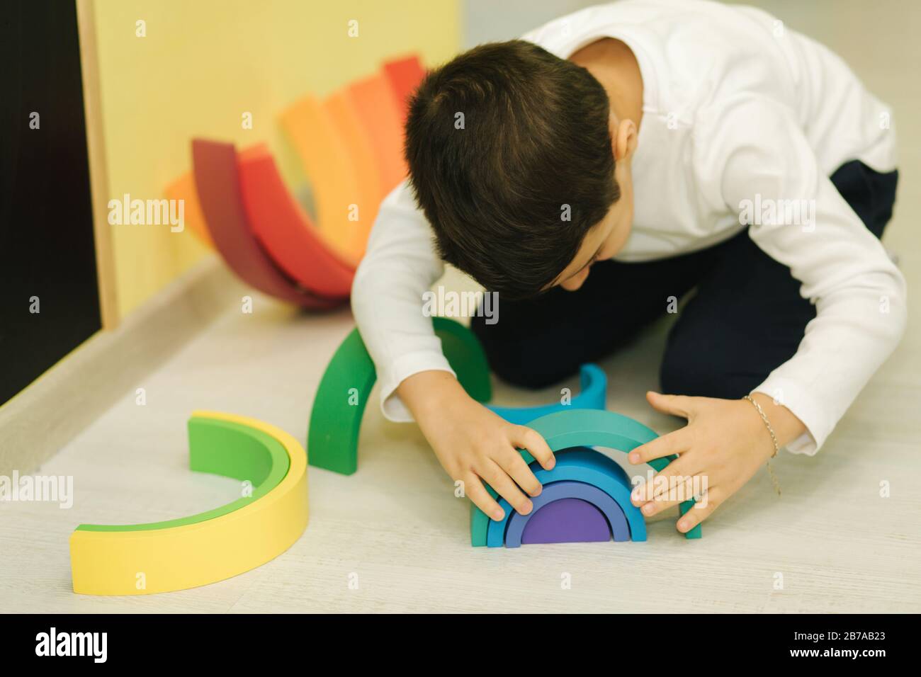 Boys play in different intelectual games in preschool classroom Stock ...