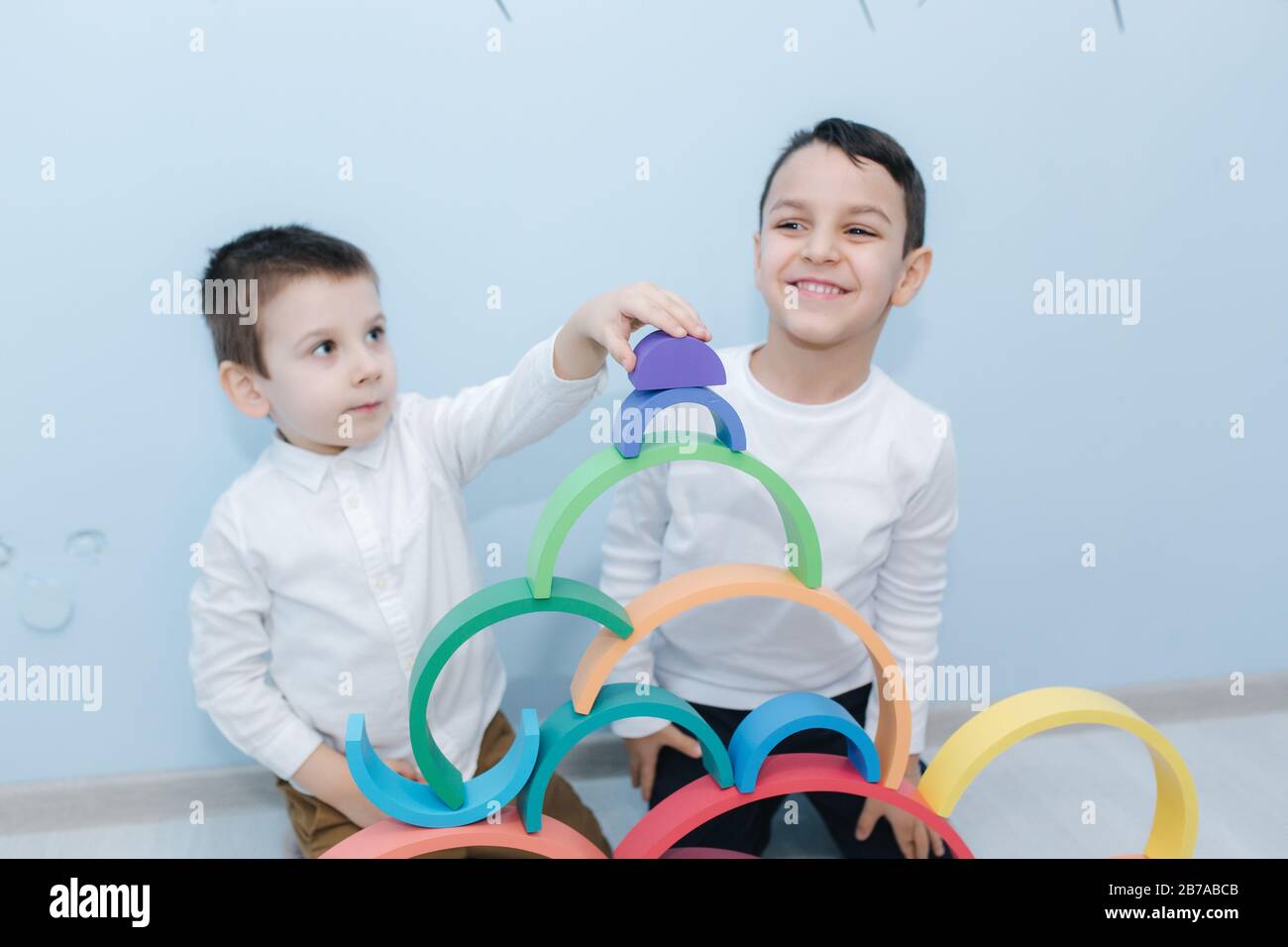 Boys play in different intelectual games in preschool classroom Stock ...