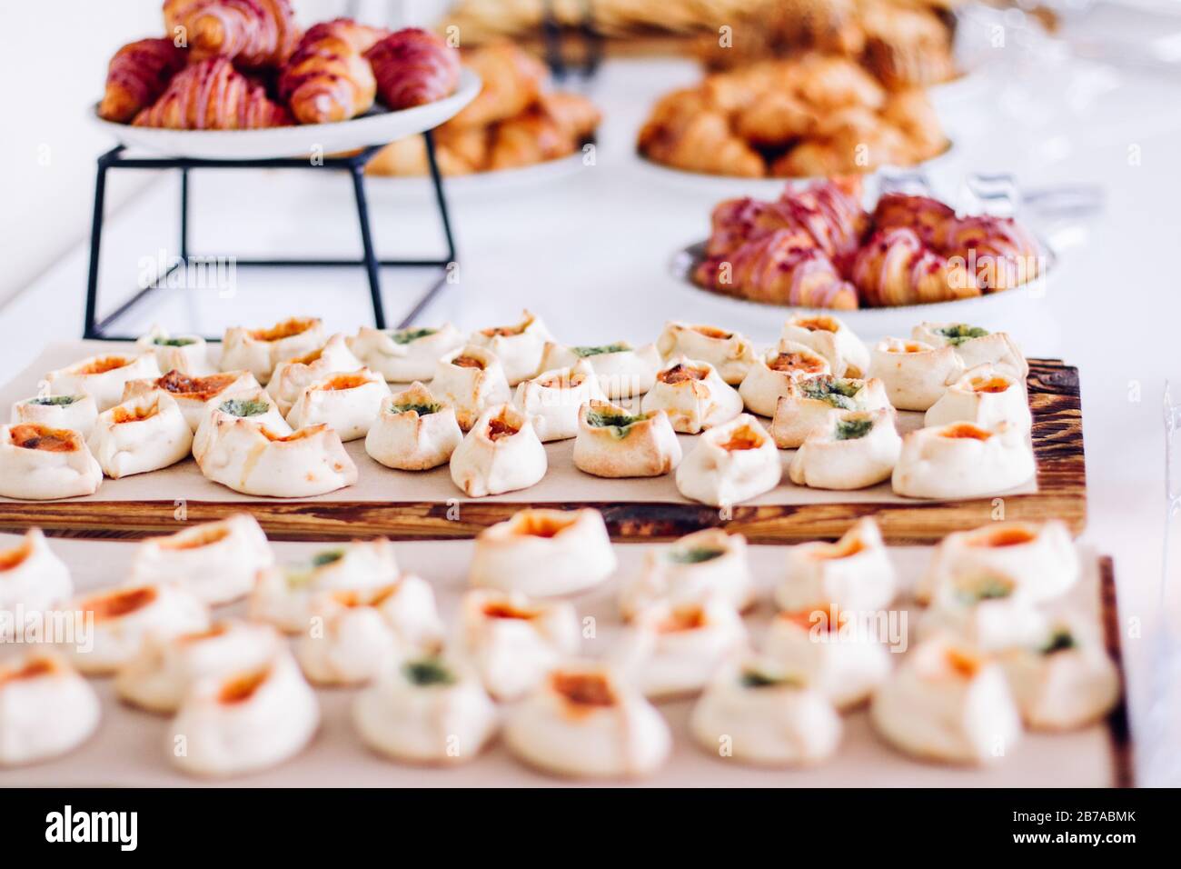 Pastry buffet served at charity event, sweet food and dessert table ...