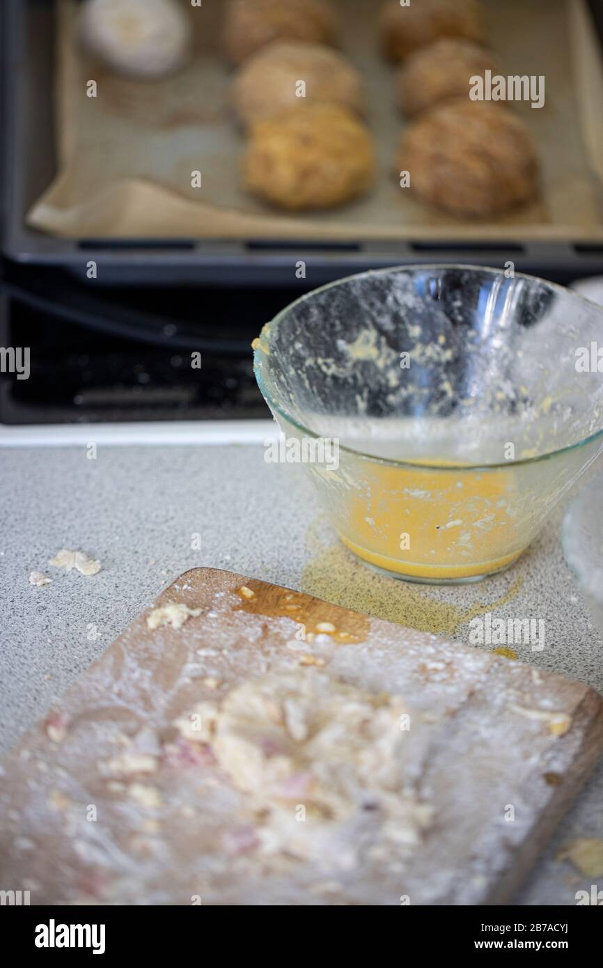 Messy dirty bread preparing and baking process with tools pots and mess ...