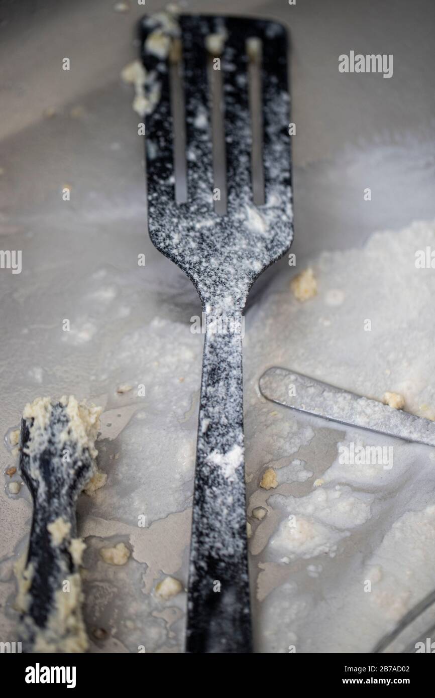 Messy dirty bread preparing and baking process with tools pots and mess ...