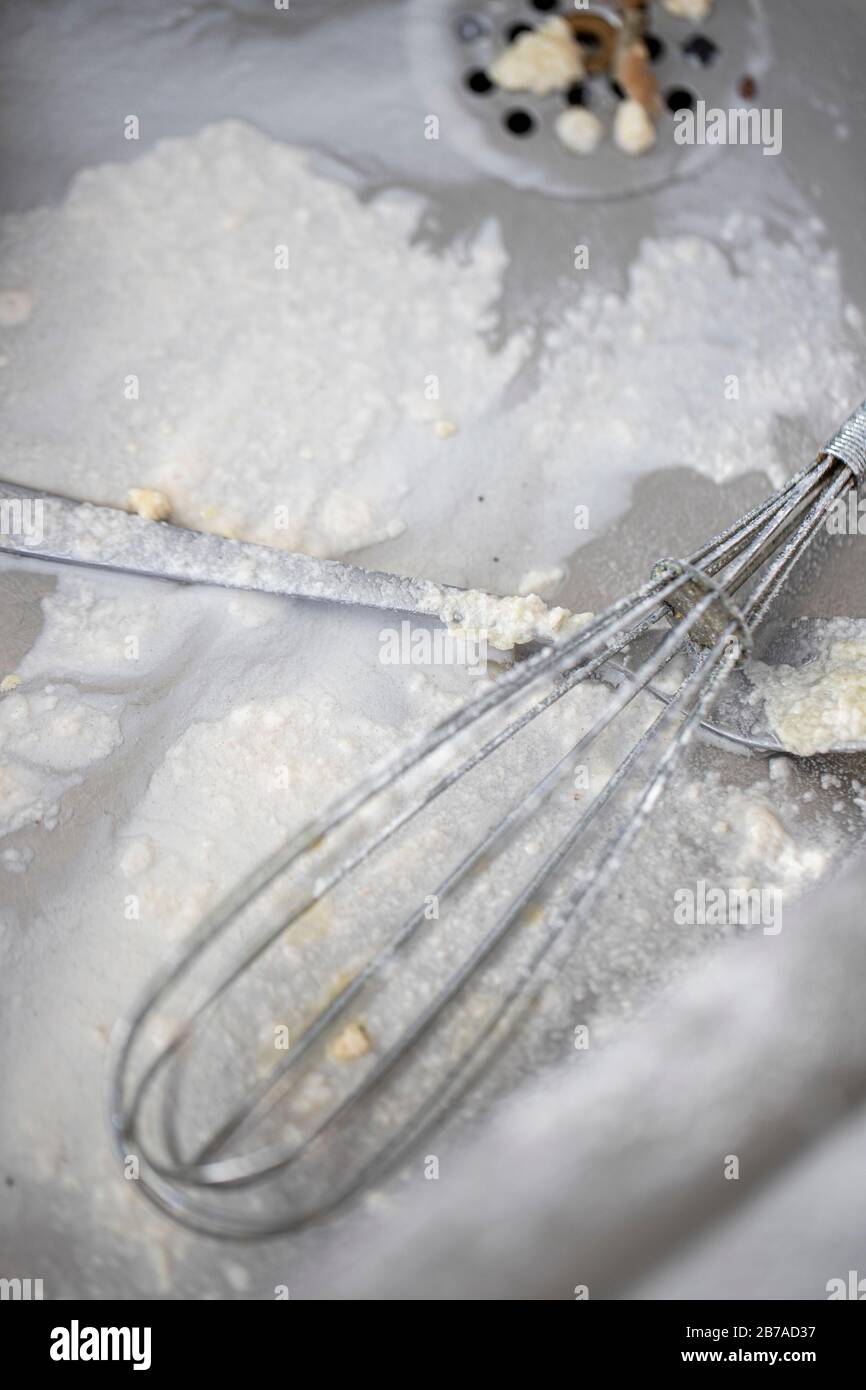 Messy dirty bread preparing and baking process with tools pots and mess ...