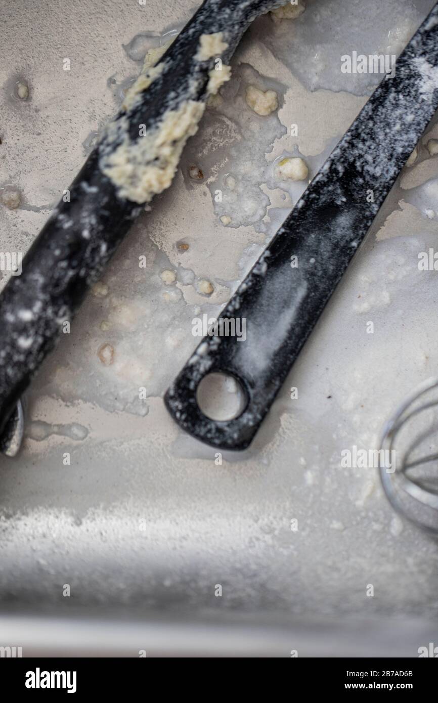 Messy dirty bread preparing and baking process with tools pots and mess ...