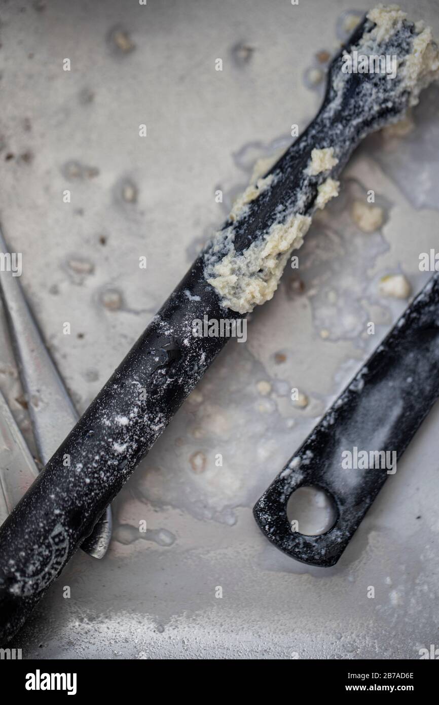 Messy dirty bread preparing and baking process with tools pots and mess ...