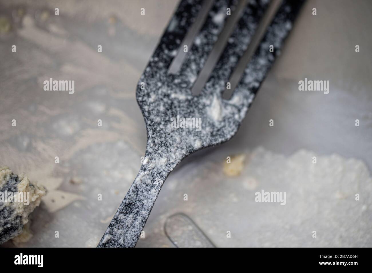 Messy dirty bread preparing and baking process with tools pots and mess ...