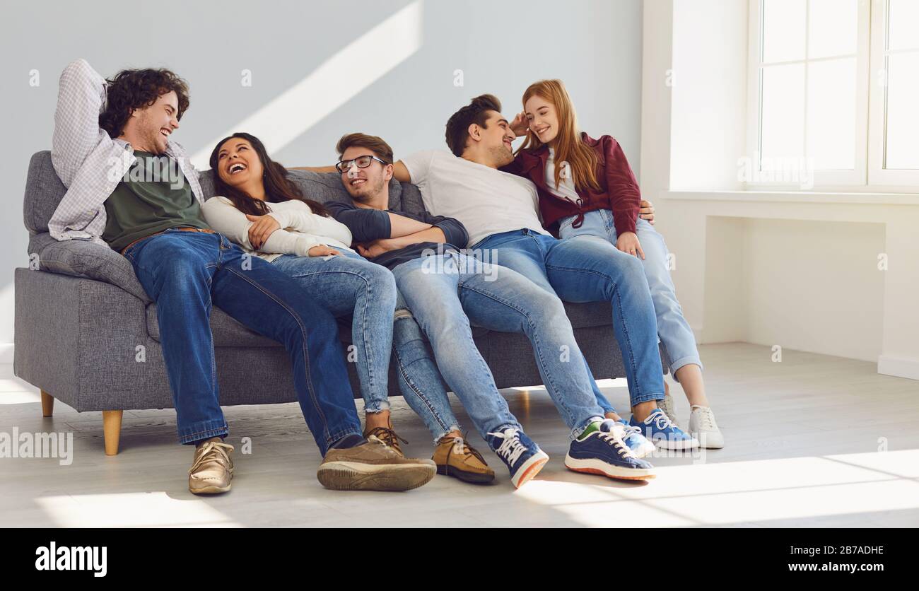 Diverse group people sitting couch hi-res stock photography and images ...