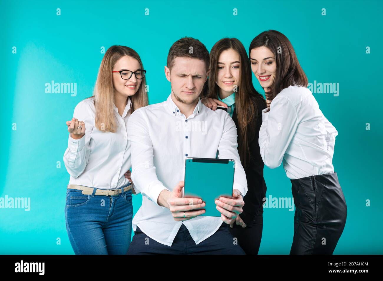Business team looks at the digital tablet screen. Business People Using ...