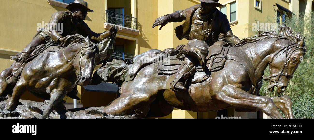Close up panoramic format of bronze equine sculptures with Hashknife ...