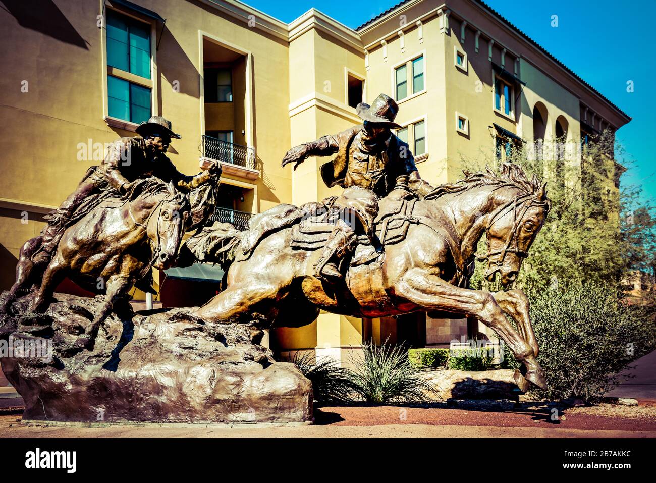 A commemorative bronze equine sculpture, "Passing the Legacy" of two ...