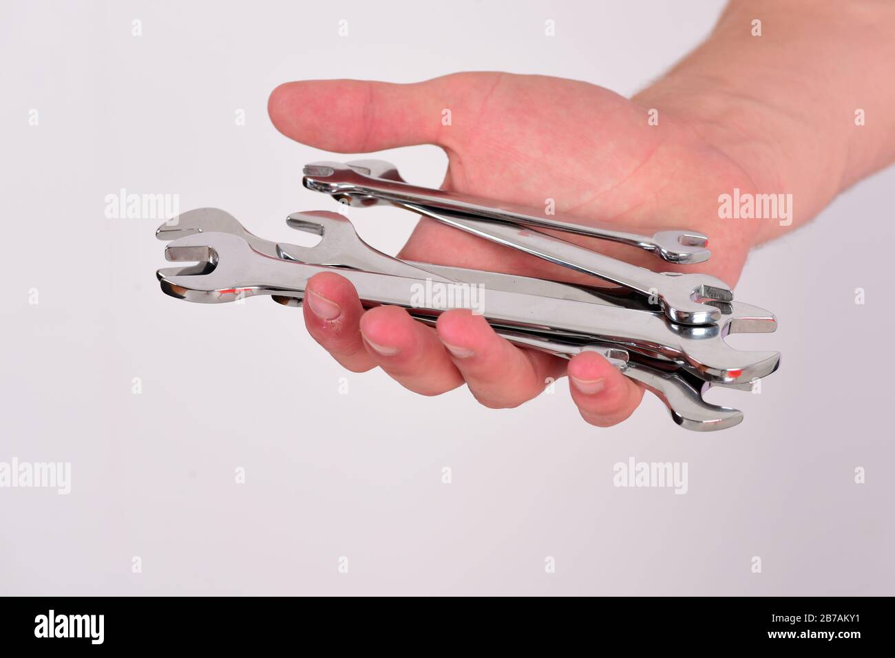 Spanner equipment made of metal. Set of wrench tools in male hand ...