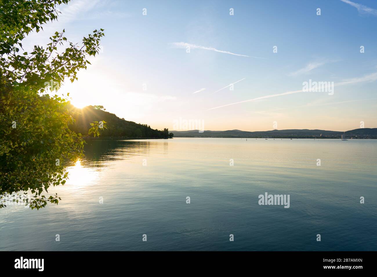 Nature reflection on the Lake Balaton in Hungary at sunset in Tihany ...
