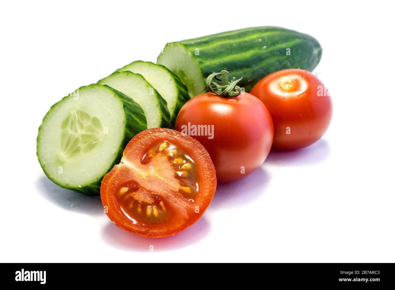 Cucumber and tomato isolated on white background Stock Photo - Alamy