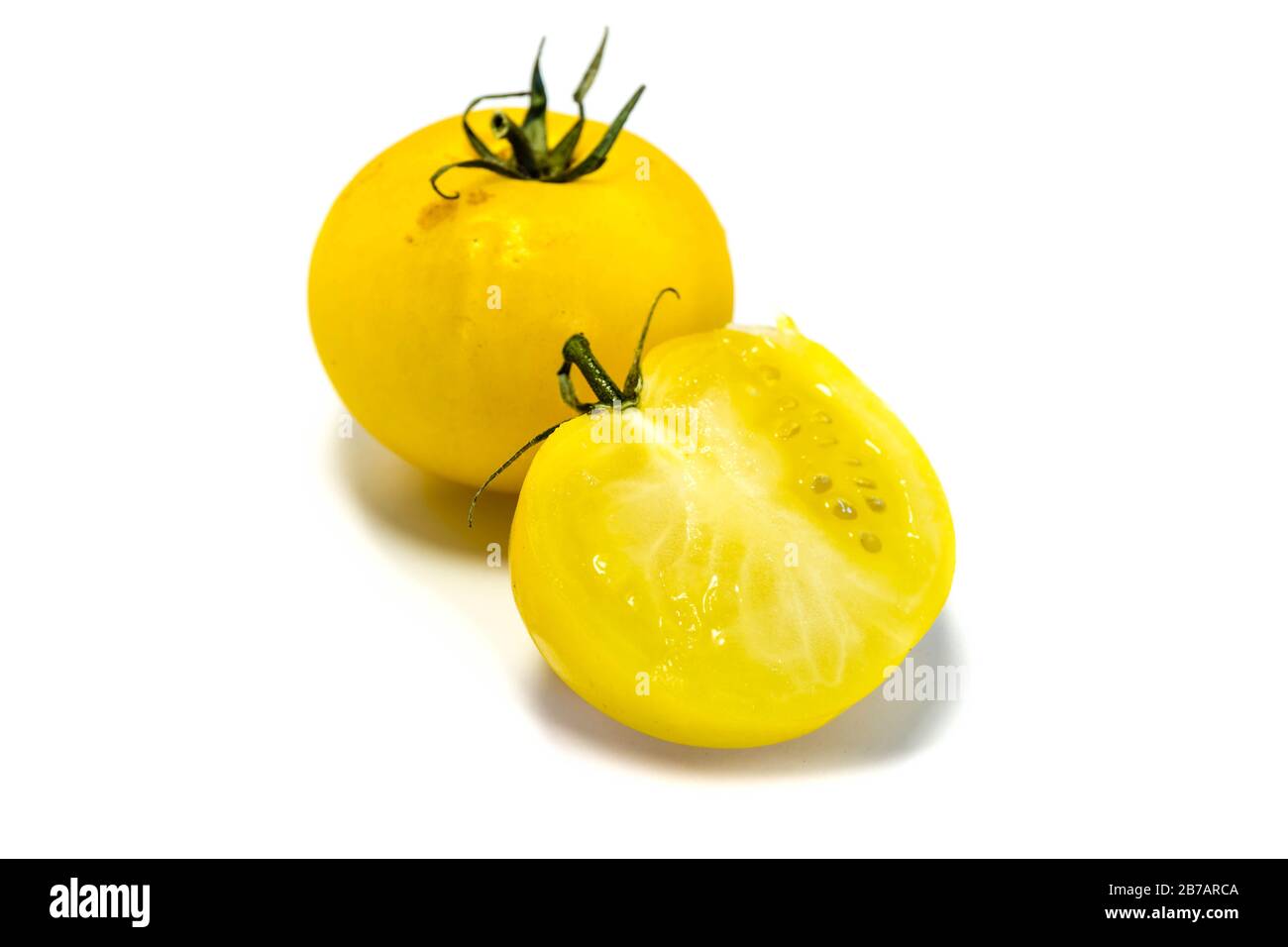 yellow tomato isolated on white background Stock Photo - Alamy