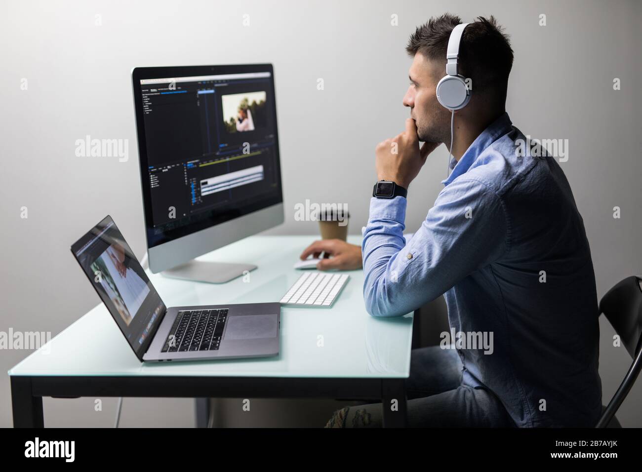 back view of video editor using computer Stock Photo - Alamy