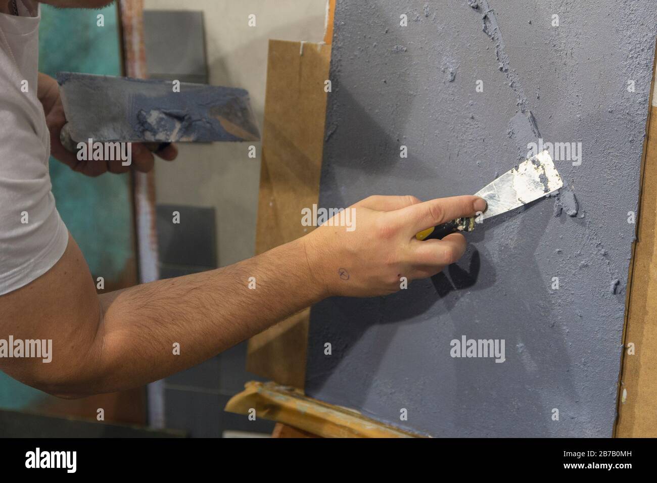 Plasterer teaches plaster wall in the master class. Industry Stock ...