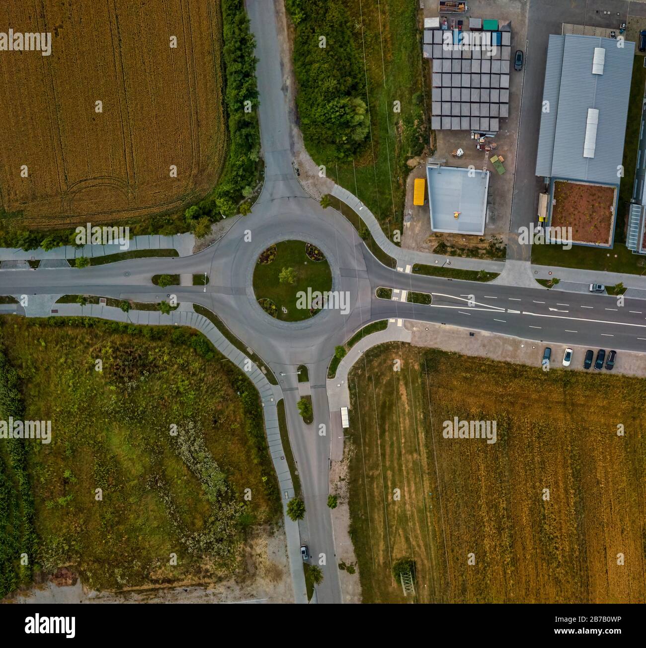 Top down aerial view of a traffic roundabout on a main road in germany ...