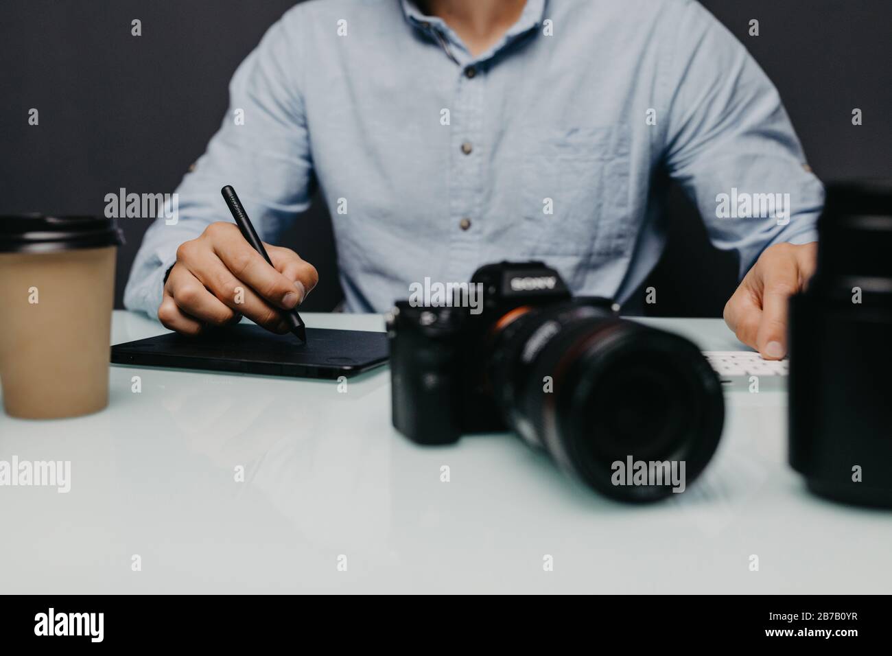 Hands close up, side view. The work of a graphic designer. Photographer ...