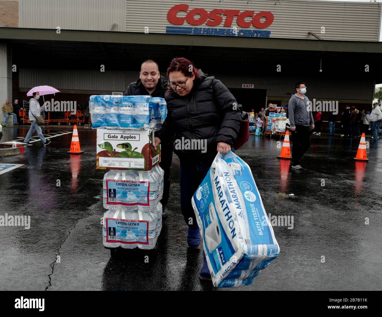 Los Angeles, California, USA. 14th Mar, 2020. Shoppers exit a Costco ...