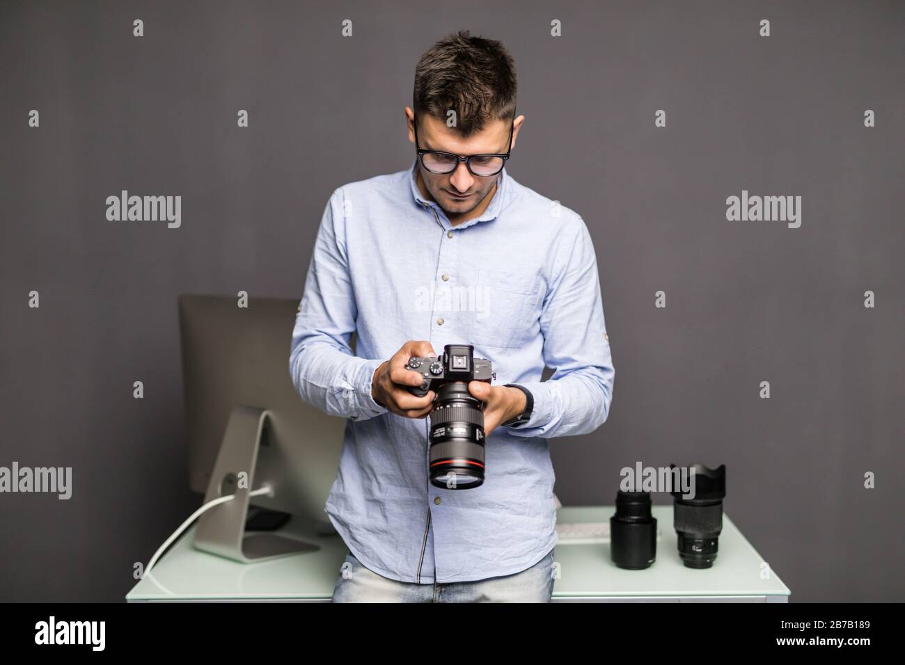 Looking at camera confidence smiling sitting photograph journalist hi ...