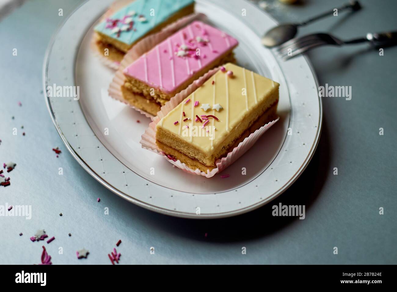 Beautiful delicate shortbread cakes with icing of delicate colors. Tea ...