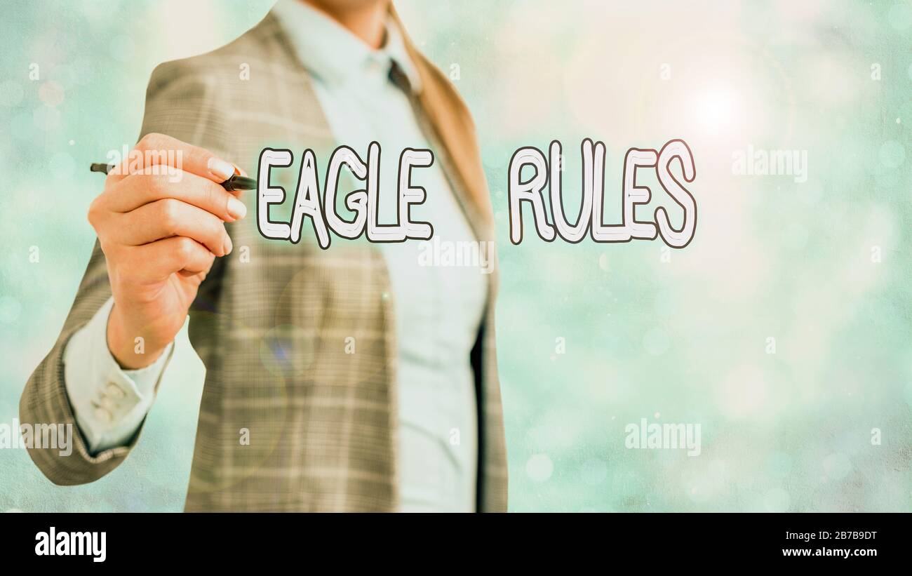 Writing note showing Eagle Rules. Business concept for a huge set of ...
