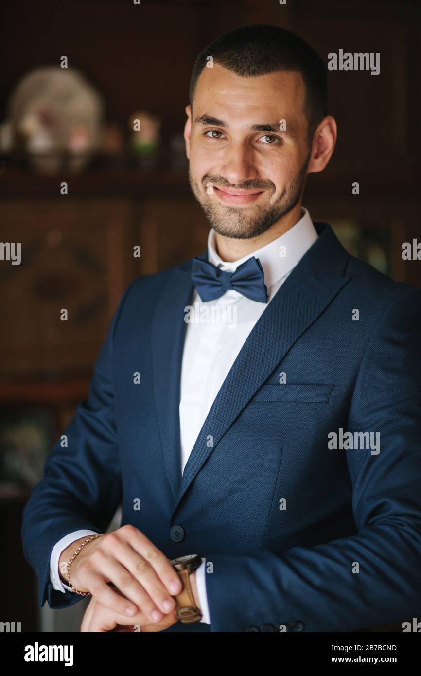 Portrait of handsome bearded groom in dark blue suit Stock Photo - Alamy