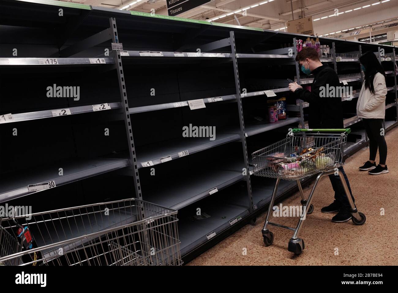 Empty shelves in the laundry aisle of an Asda store in London Stock ...