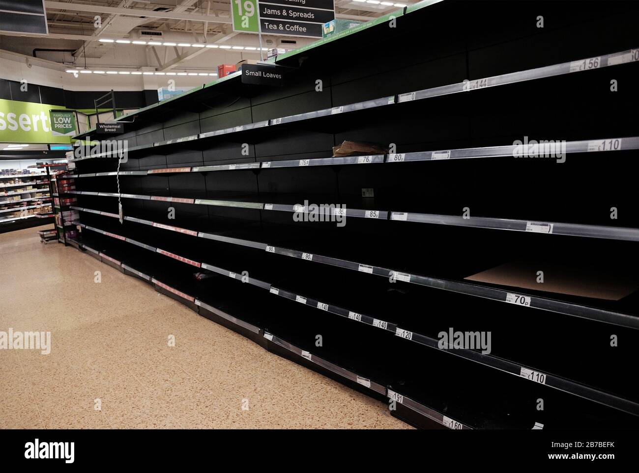 Empty shelves in the bakery aisles of an Asda store in London. PA Photo ...