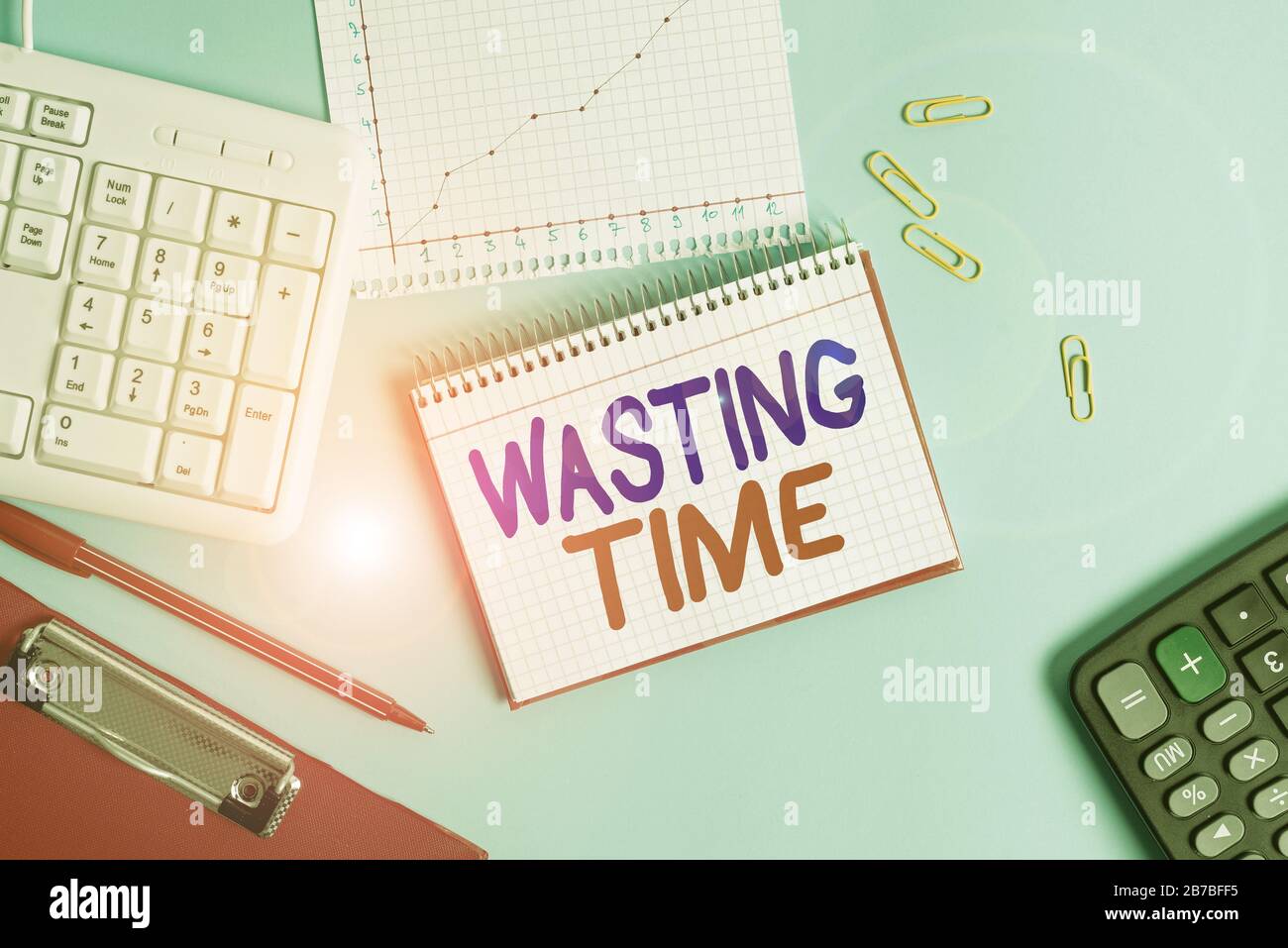 Writing note showing Wasting Time. Business concept for act of spending ...