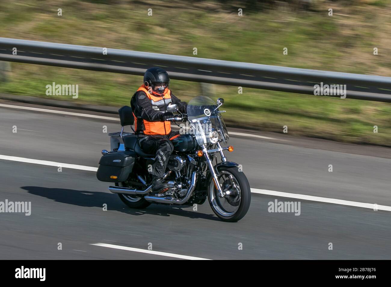 Harley Davidson motorbike driving on the M6 motorway near Preston in ...